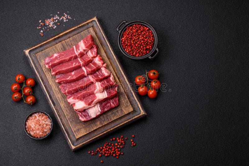 Fresh Raw Beef Cut into Slices with Salt, Spices Stock Photo - Image of ...