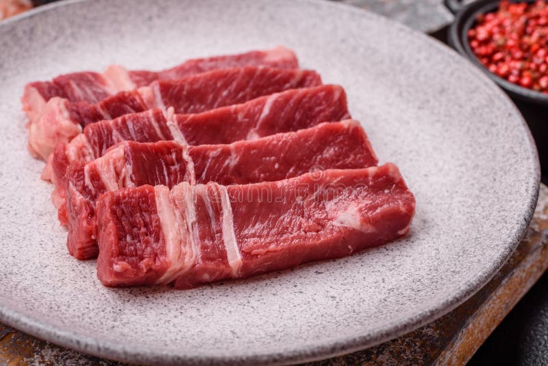 Fresh Raw Beef Cut into Slices with Salt, Spices Stock Photo - Image of ...