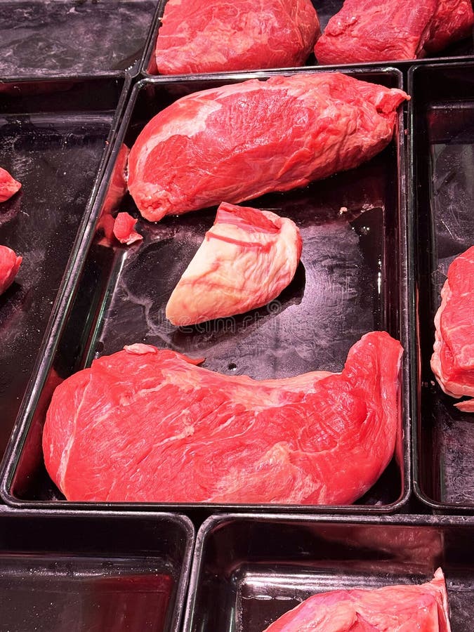 Fresh Raw Beef Cuts Displayed in Meat Market Counter Stock Photo ...