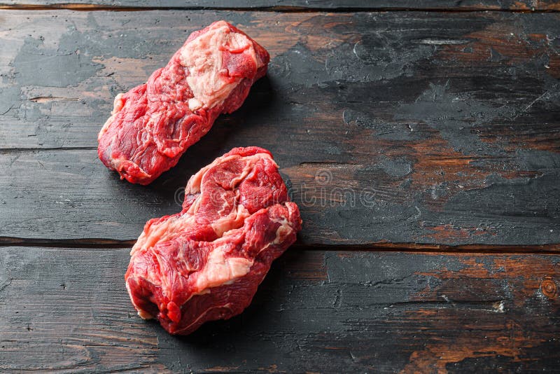 Fresh Raw Beef Marbled Steak. Chuck Eye Roll on Old Dark Wooden Table ...