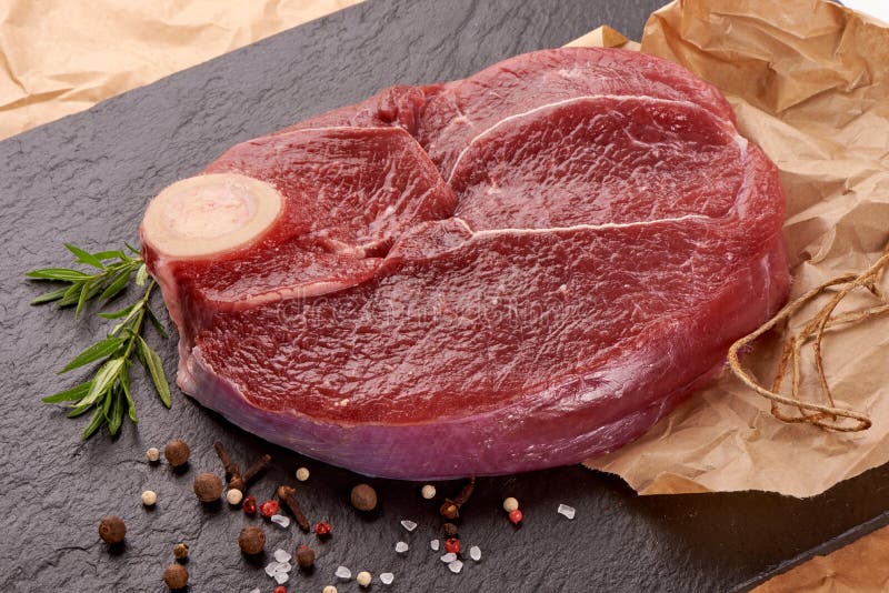 Fresh Raw Beef Meat with Bone for Steak on Stone Plate Stock Photo ...