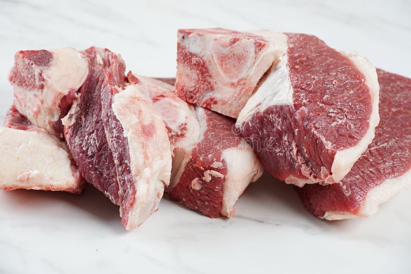 Fresh Raw Beef Steaks with Bone on Cutting Board Ready for Cooking ...