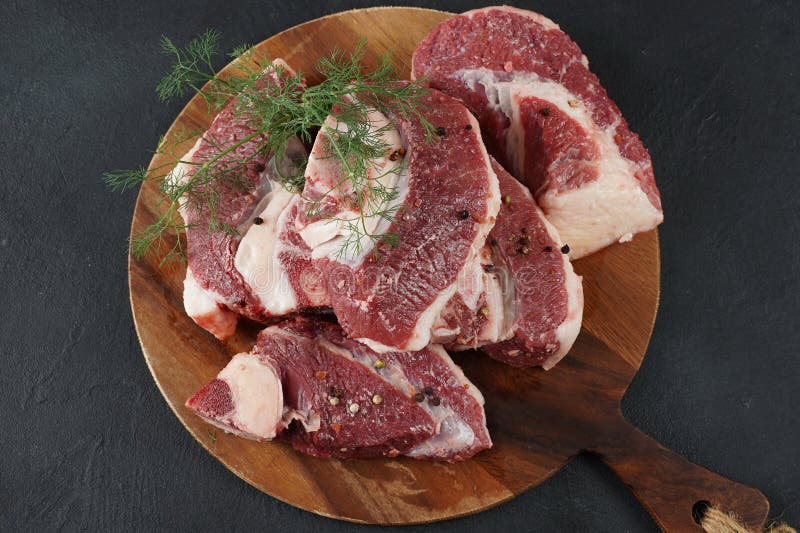 Fresh Raw Beef Steaks with Bone on Cutting Board Ready for Cooking ...