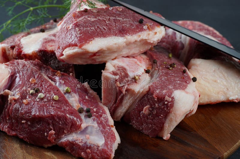 Fresh Raw Beef Steaks with Bone on Cutting Board Ready for Cooking ...