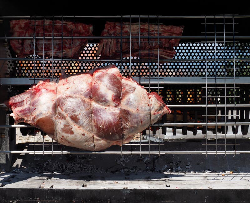 Fresh and Raw Bull Meat Just Put on the Rotating Grill, Ready for ...
