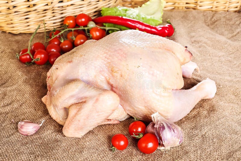 Fresh Raw Chicken Carcass Wooden Board with Tomato Stock Photo - Image ...