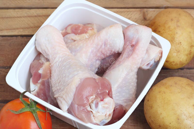 Fresh raw chicken legs stock photo. Image of chicken - 66704072