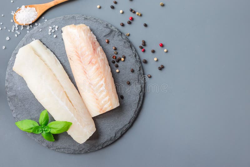 Fresh Raw Cod Fillet with Spices, Pepper, Salt, Basil on Stone P Stock ...