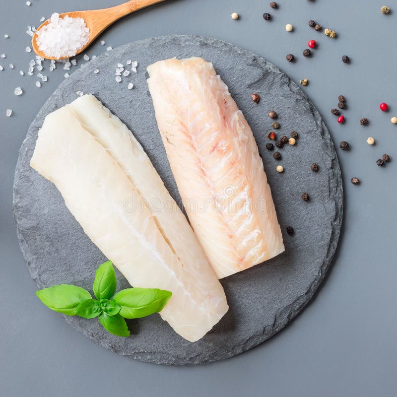 Fresh Raw Cod Fillet with Spices, Pepper, Salt, Basil on a Stone Stock ...