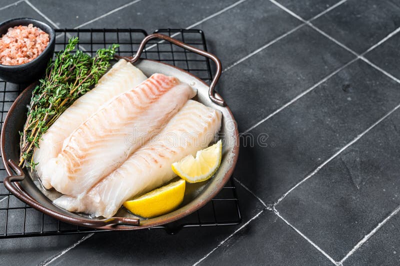 Fresh Raw Cod Fish Fillets with Herbs Served on Steel Tray. Black ...