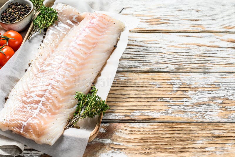 Fresh Raw Cod Loin Fillet with Thyme. White Wooden Background. Top View ...