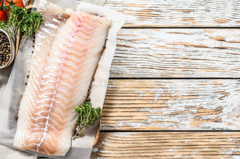 Fresh Raw Cod Loin Fillet with Thyme. White Wooden Background. Top View ...