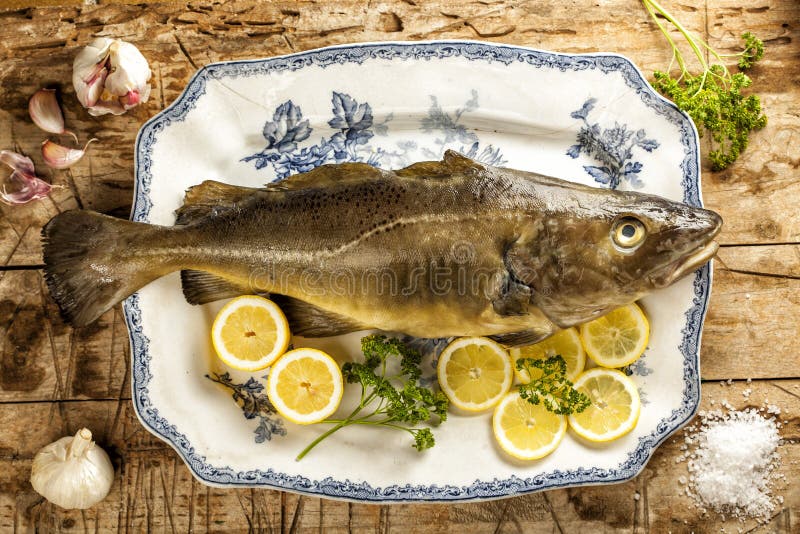 Fresh Raw Cod Served on a Tray with Ingredients for Recipe. Stock Photo ...