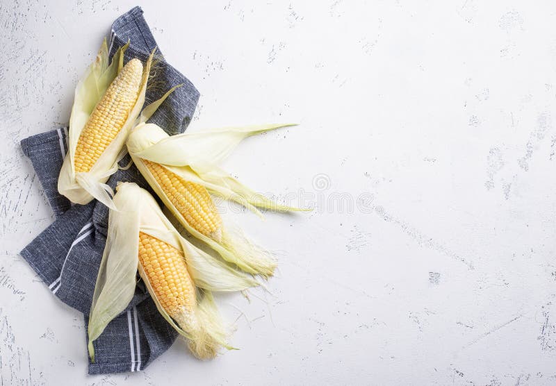 Raw corn on concrete table stock image. Image of natural - 158769659