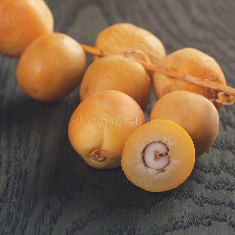 Fresh raw dates on table stock image. Image of palm - 100264849