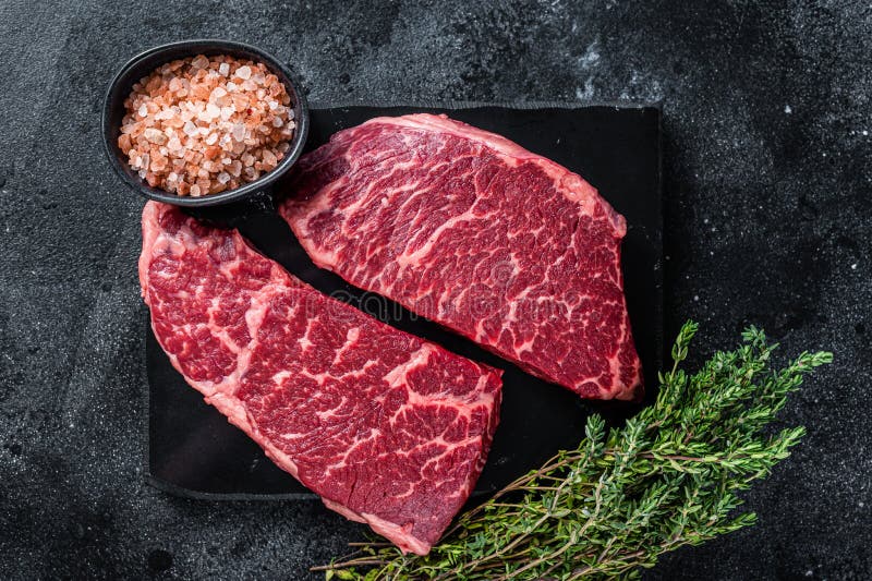 Raw Denver Cut Black Angus Beef Steak on a Butcher Board with Meat ...