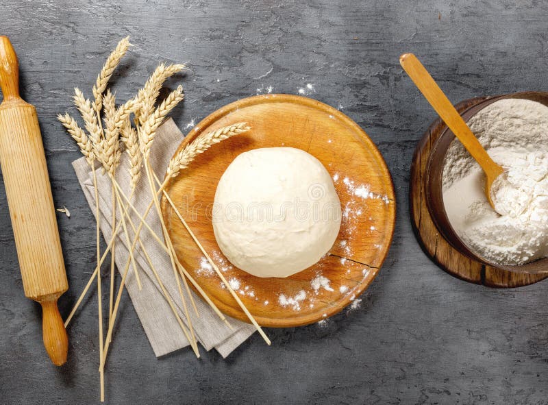 Fresh Raw Dough on Dark Surface in Bakery, Top View Stock Photo - Image ...