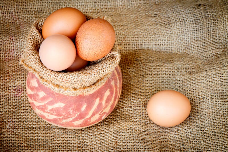 Fresh raw eggs in clay pot stock image. Image of cuisine - 59214411