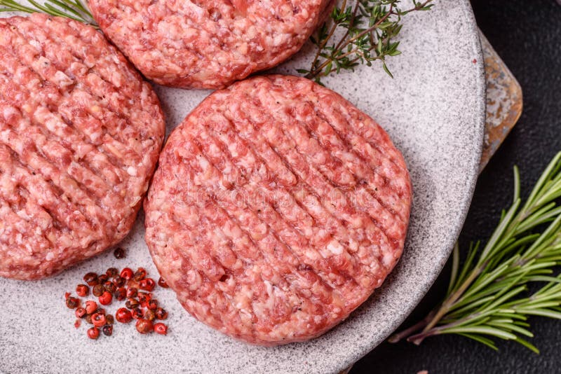 Fresh Raw Ground Beef Burger Patty with Salt and Spices Stock Photo ...