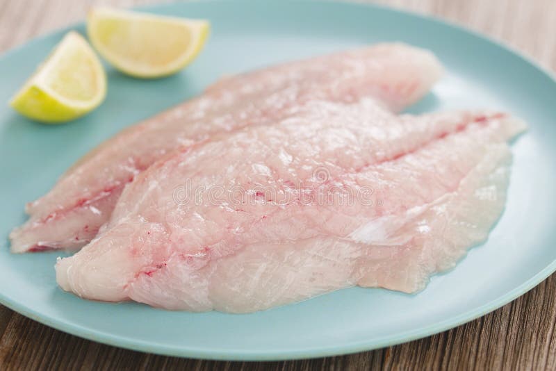 Fresh Raw Jack Fish Fillets on Blue Plate Stock Photo - Image of meat ...