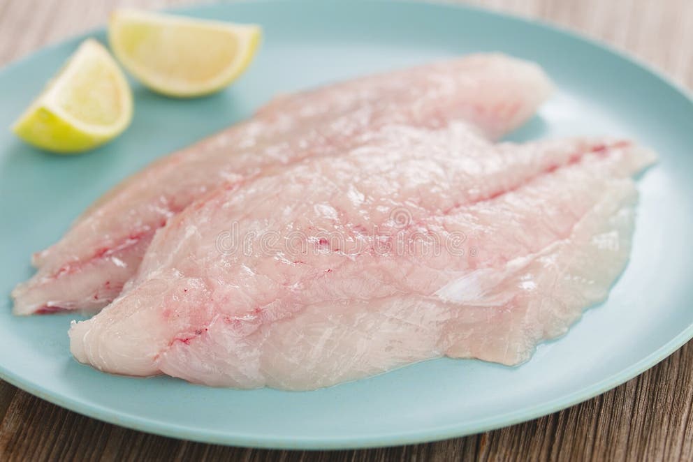 Fresh Raw Jack Fish Fillets on Blue Plate Stock Photo - Image of meat ...