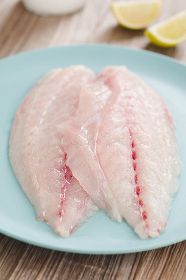 Fresh Raw Jack Fish Fillets on Blue Plate Stock Image - Image of ...
