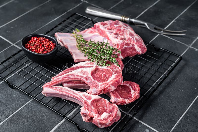 Fresh Raw Lamb Meat Chop Steaks on Kitchen Table with Spices and Herbs ...