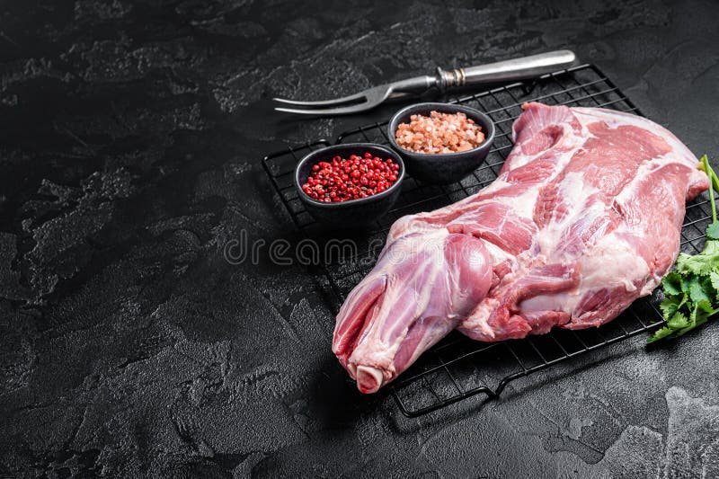 Fresh Raw Lamb Shoulder Leg on Kitchen Table Ready for Cooking. Black ...
