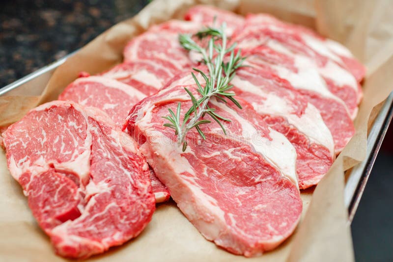 Fresh Raw Meat on Metal Plate on Dark Table. Selective Focus. Stock ...