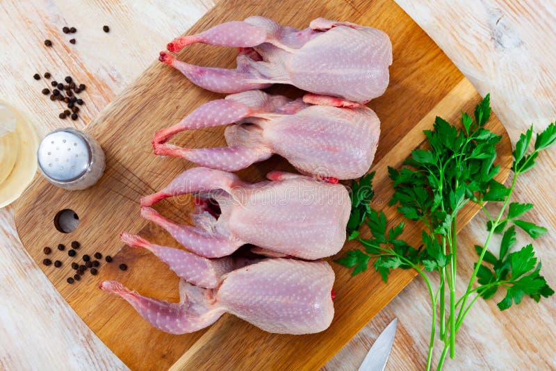 Fresh Raw Meat Quails Ready for Cooking on Slate Board Stock Photo ...