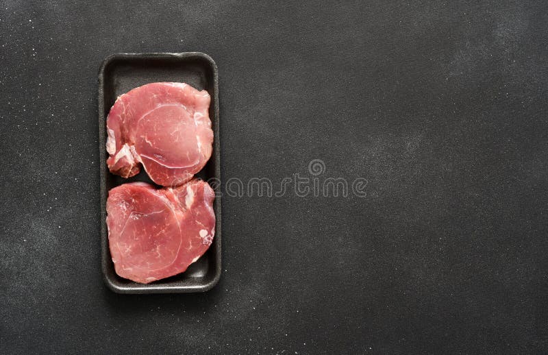 Fresh Raw Meat in a Tray on a Black Background Stock Photo - Image of ...