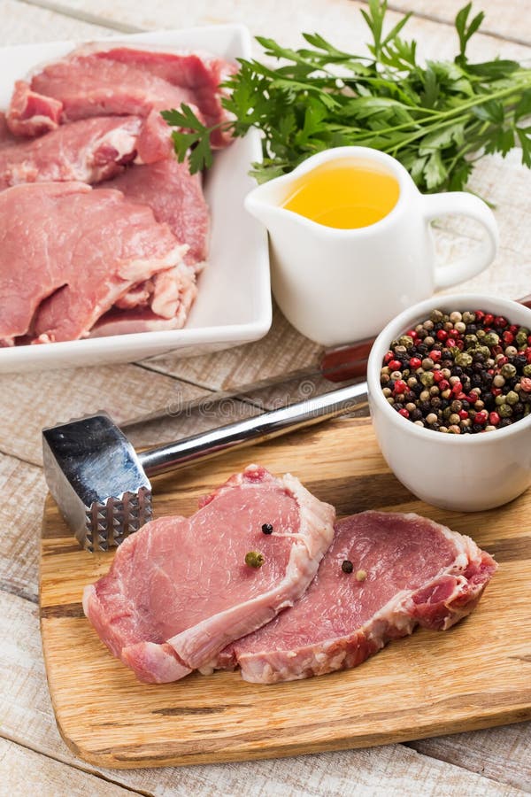 Fresh Raw Meat on Wooden Background with Pepper Stock Photo - Image of ...