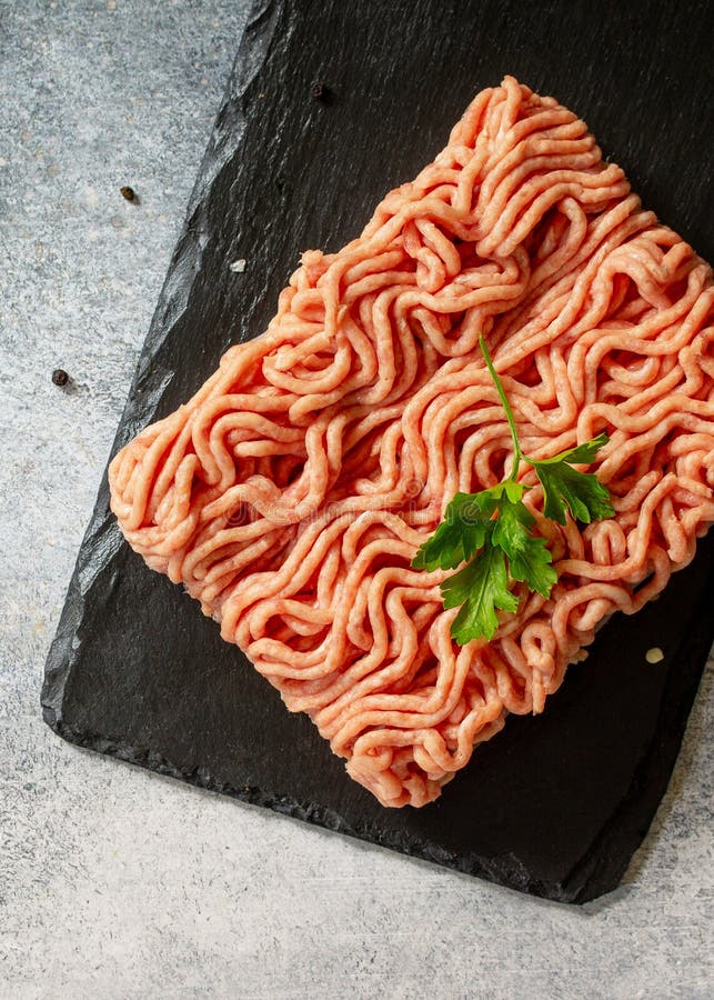 Fresh Raw Mince. Ground Minced Beef on Stone Slate Blackboard Stock ...