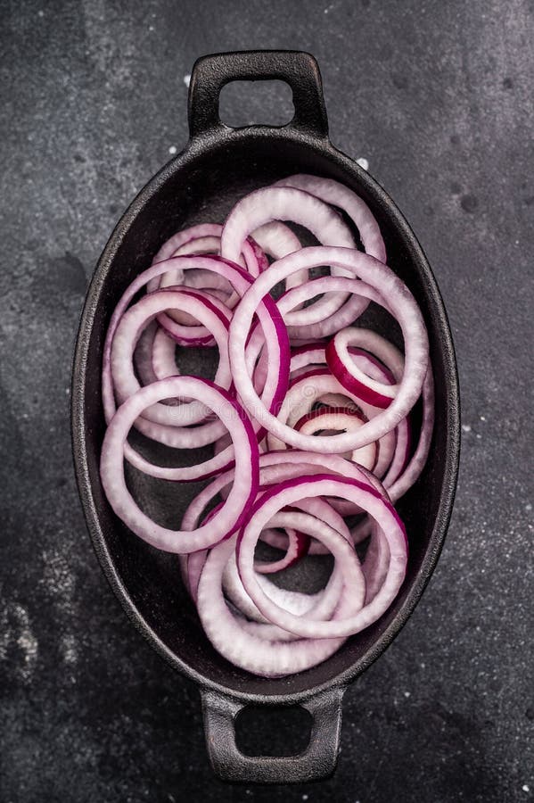 Fresh Raw Onion Rings in Skillet. Black Background Stock Photo - Image ...