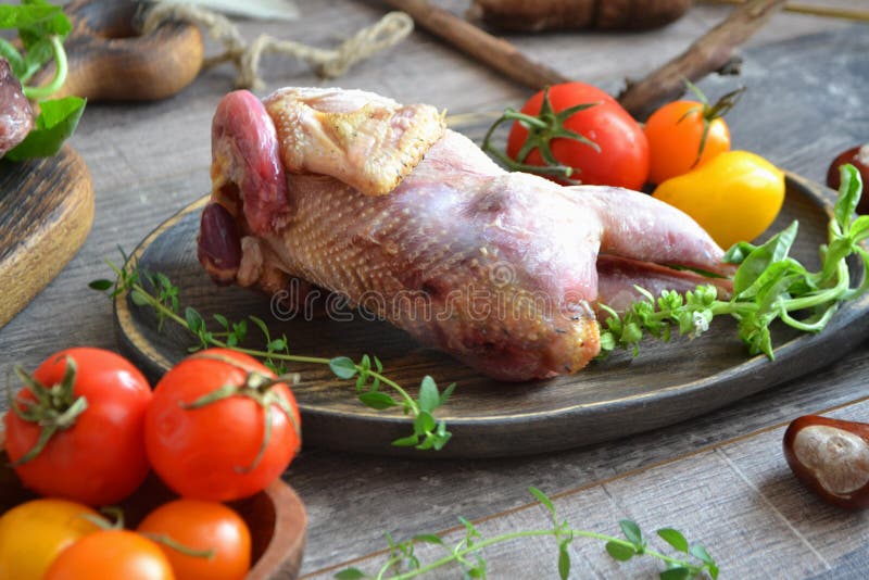 Fresh Raw Partridge on a Rustic Wooden Plate and Ingredients Stock ...