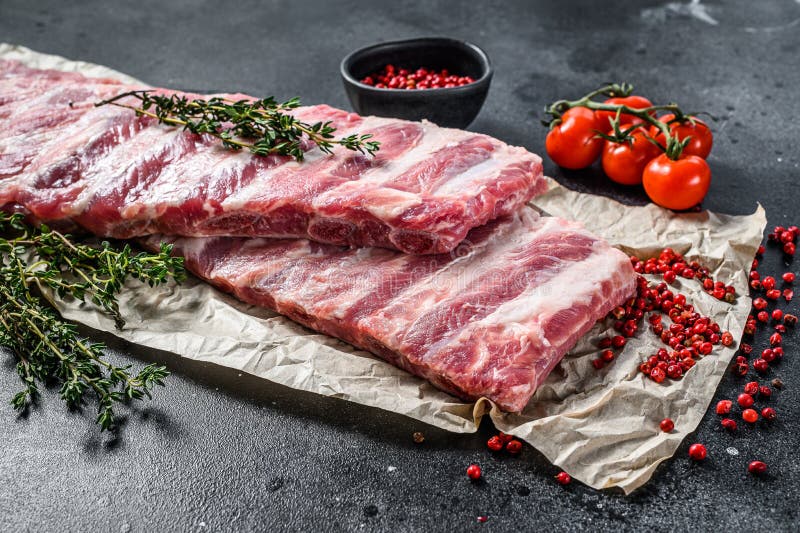 Fresh Raw Pork Ribs with Spices and Herbs. Black Background Stock Image ...