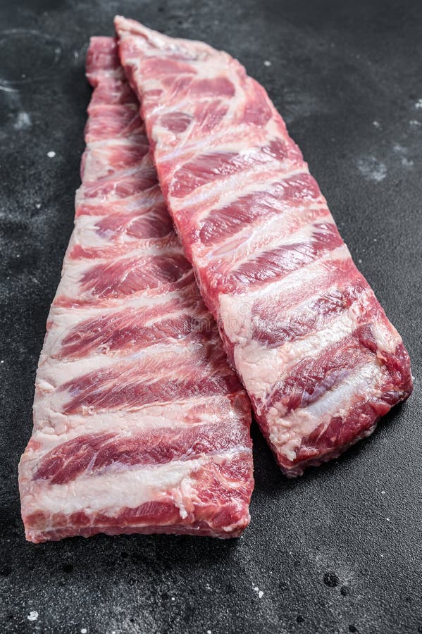 Fresh Raw Pork Spare Ribs. Black Background Stock Photo - Image of ...