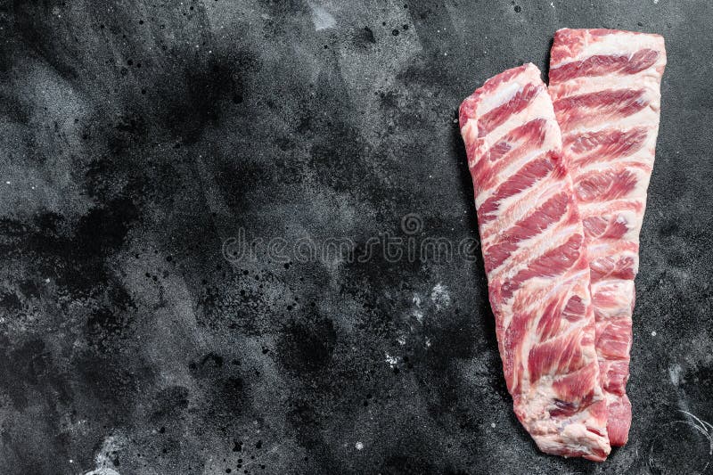 Fresh Raw Pork Spare Ribs. Black Background. Top View Stock Photo ...