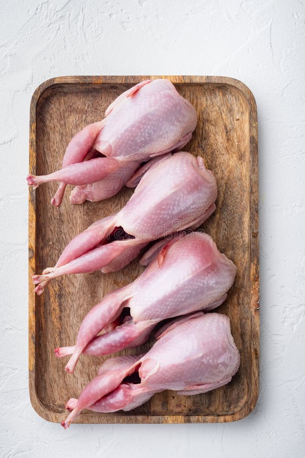 Fresh Raw Quail, Top View, on White Textured Background Stock Image ...