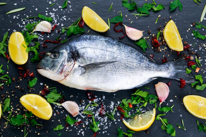 Fresh Raw Sea Bream Fish on Blue Stone Background. Stock Photo - Image ...