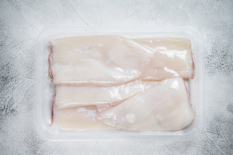 Raw Squid or Calamari in a Vacuum Package from the Supermarket. White ...