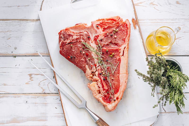 Fresh and Raw T-bone Steak on White Wooden Background Stock Photo ...