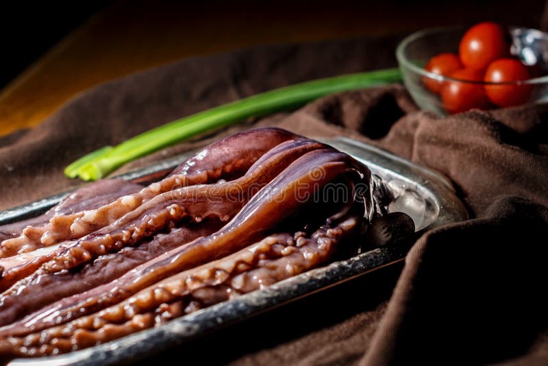 Fresh Raw Whole Squid on a Metal Dish. Tomatoes. the View from the Top ...