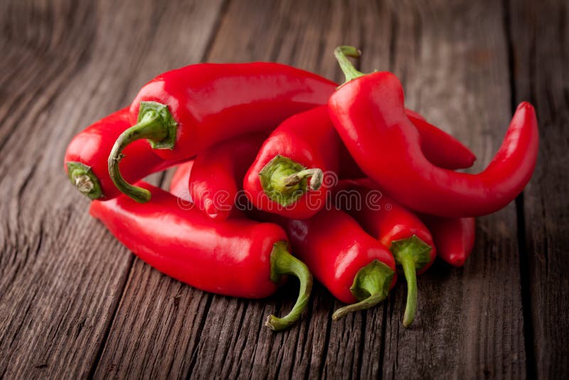 Fresh Red Chilli on a Wooden Table Stock Photo - Image of table, pepper ...