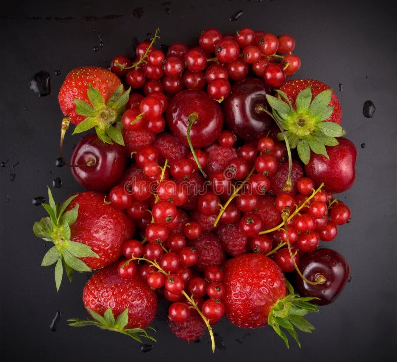 Fresh red fruit on black stock photo. Image of tasty - 15075556