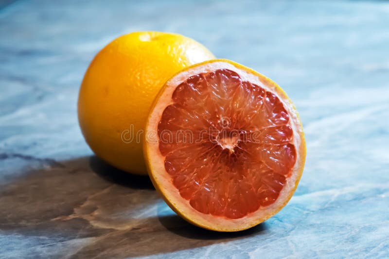 Fresh Red Grapefruit Slice on Table Stock Photo - Image of juicy ...