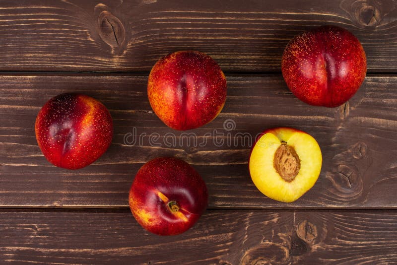 Fresh Red Nectarine on Brown Wood Stock Photo - Image of peach, ripe ...