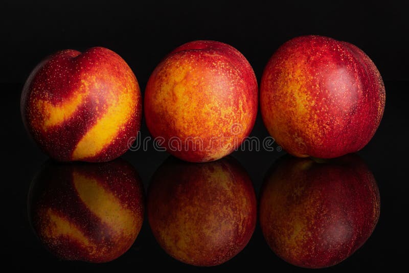 Fresh Red Nectarine Isolated on Black Glass Stock Photo - Image of ...