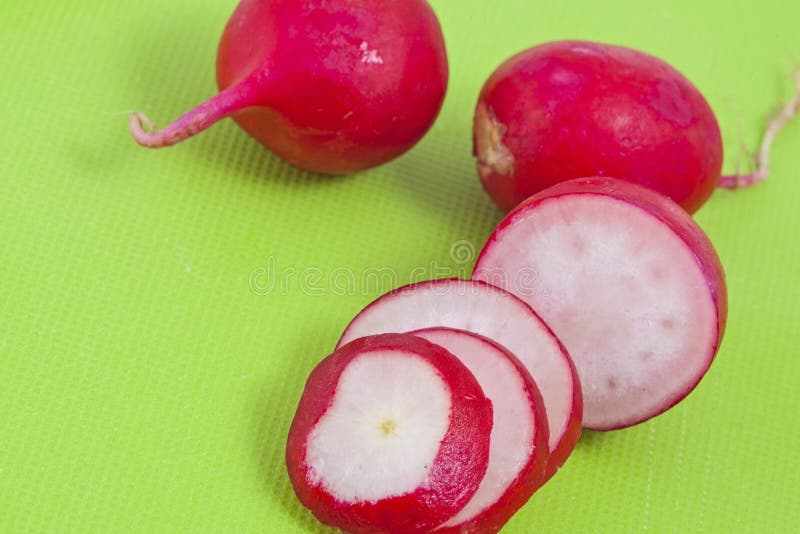 Fresh red radish on green stock photo. Image of plate - 184435620