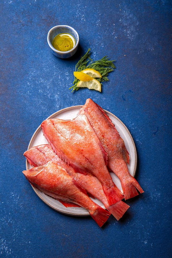 Fresh Red Sea Bass on Blue Background. Top View, Copy Space Stock Photo ...